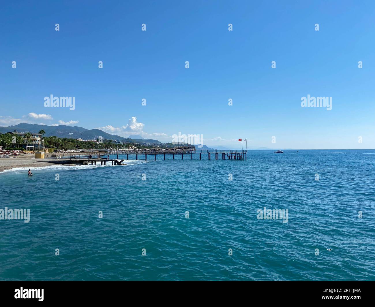 Pier sea beach and mountains in Turkey on vacation in a heavenly warm ...