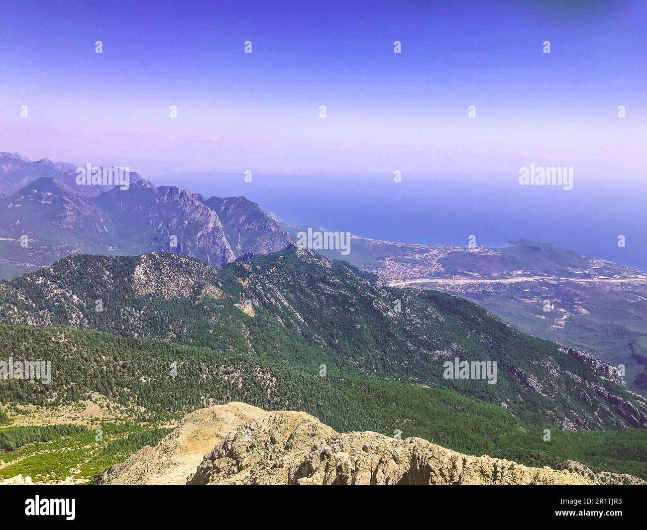 mountains against a blue bright sky in a hot tropical country. green ...