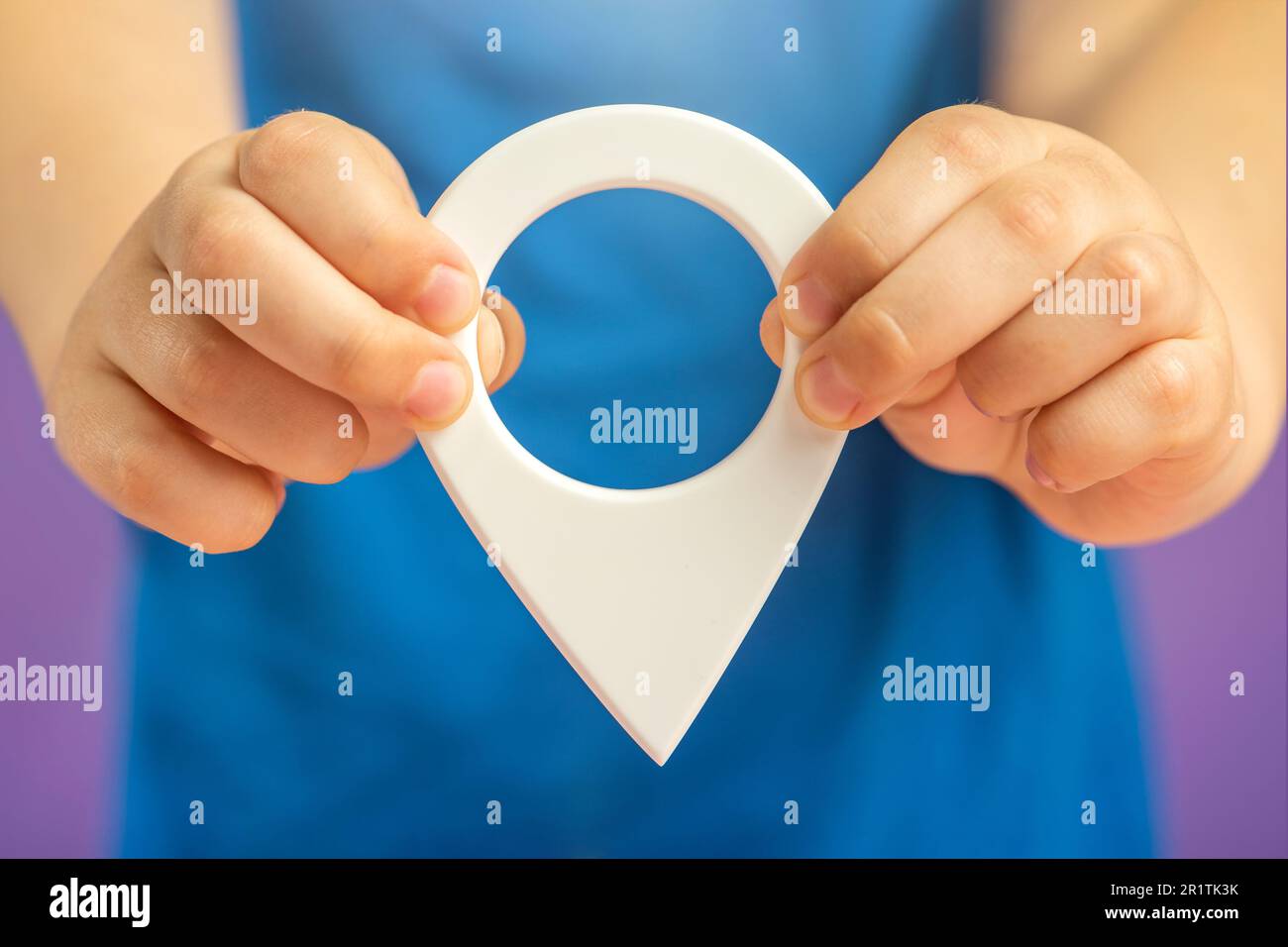 Travel concept. Hand holding pin icon or navigation tag. GPS direction ...