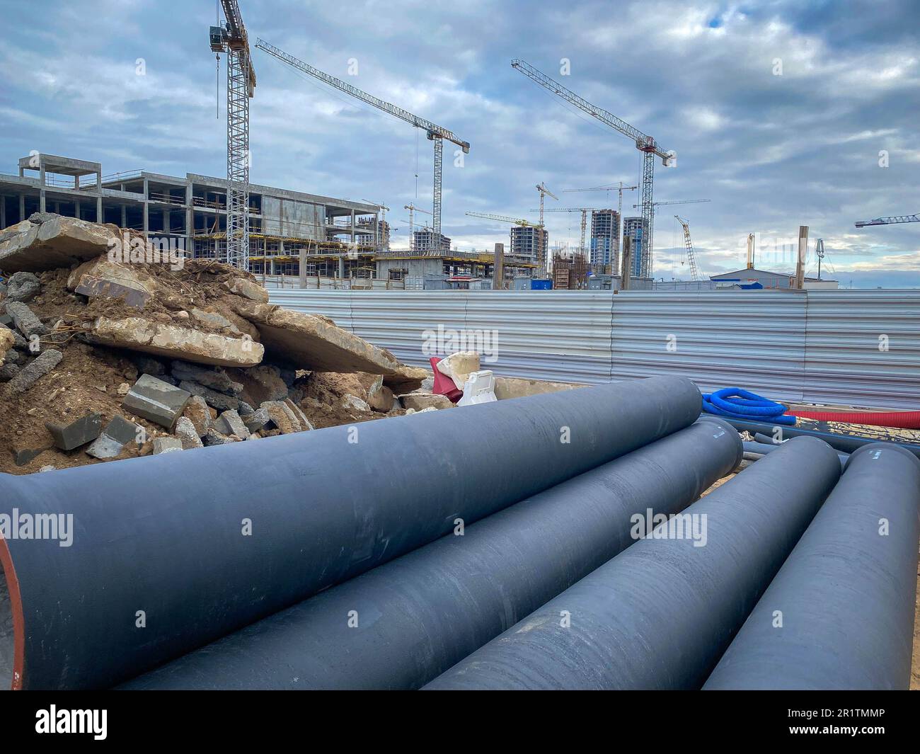 polypropylene pipes made of black material lie on a construction site ...