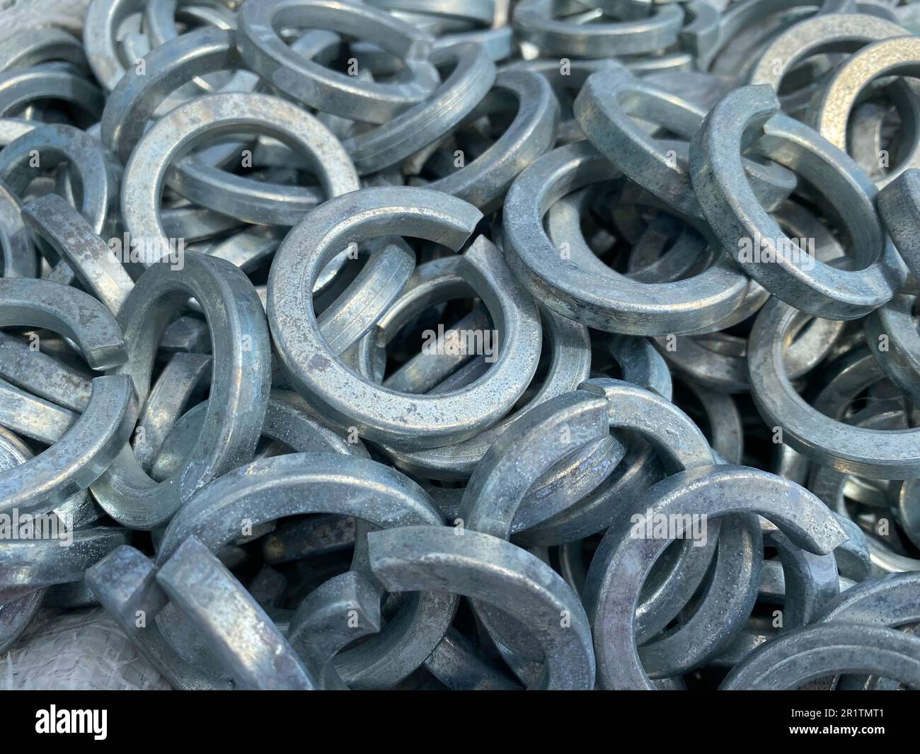 Background, texture of many metal small iron round washers for bolts ...