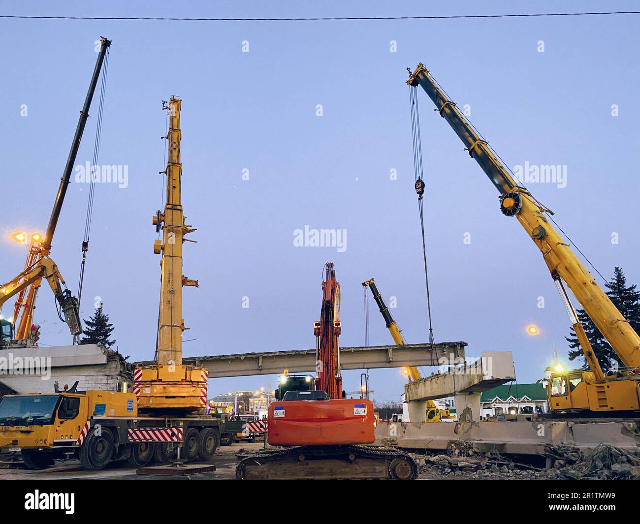 construction of a broken bridge on a busy road. construction equipment ...