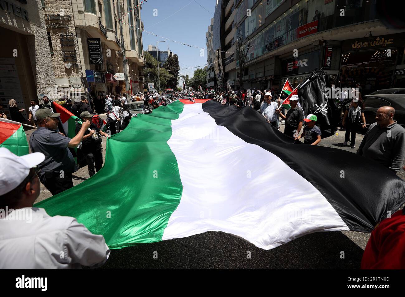 Ramallah. 15th May, 2023. Palestinian people participate in a ...