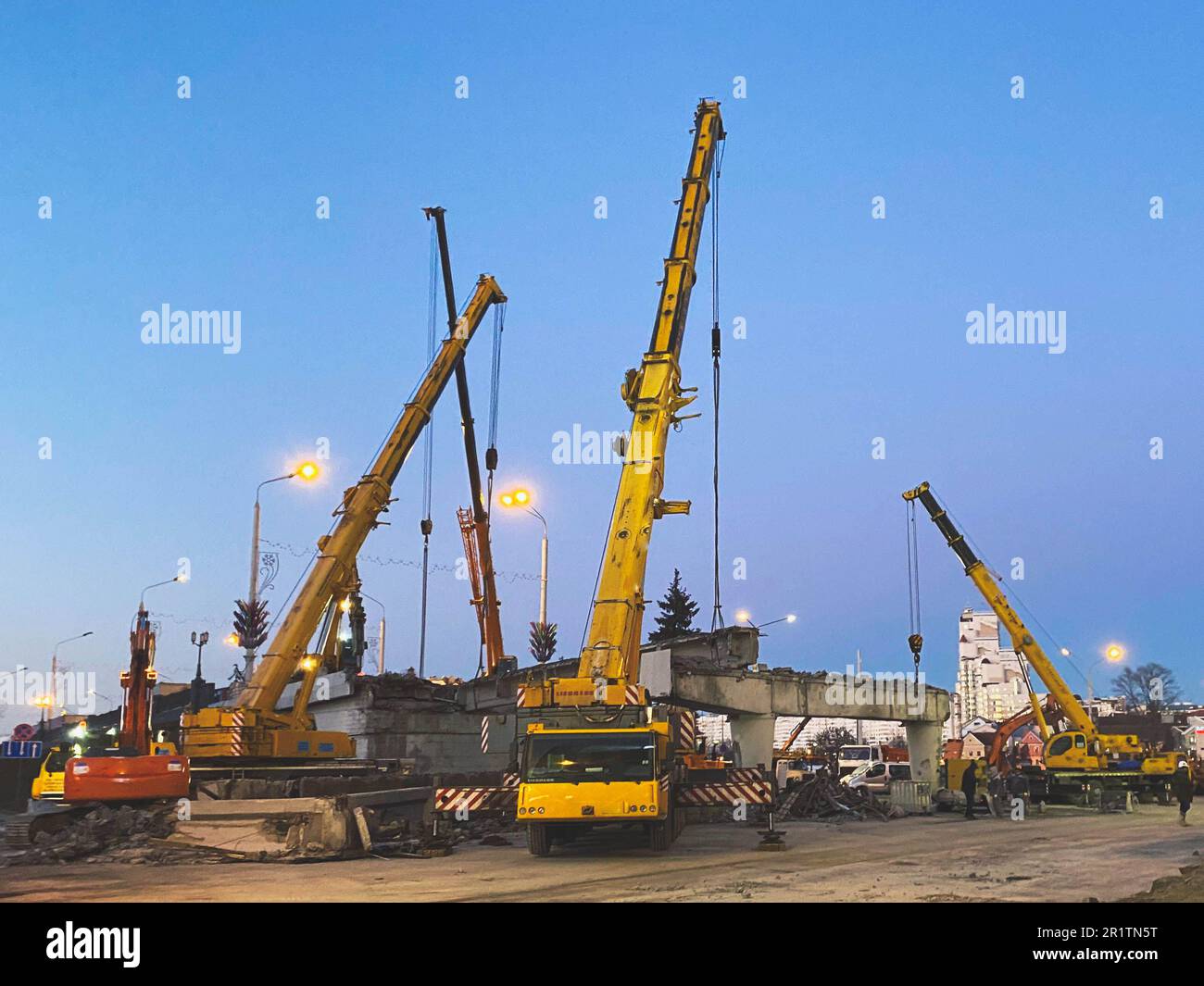 construction of a broken bridge on a busy road. construction equipment ...