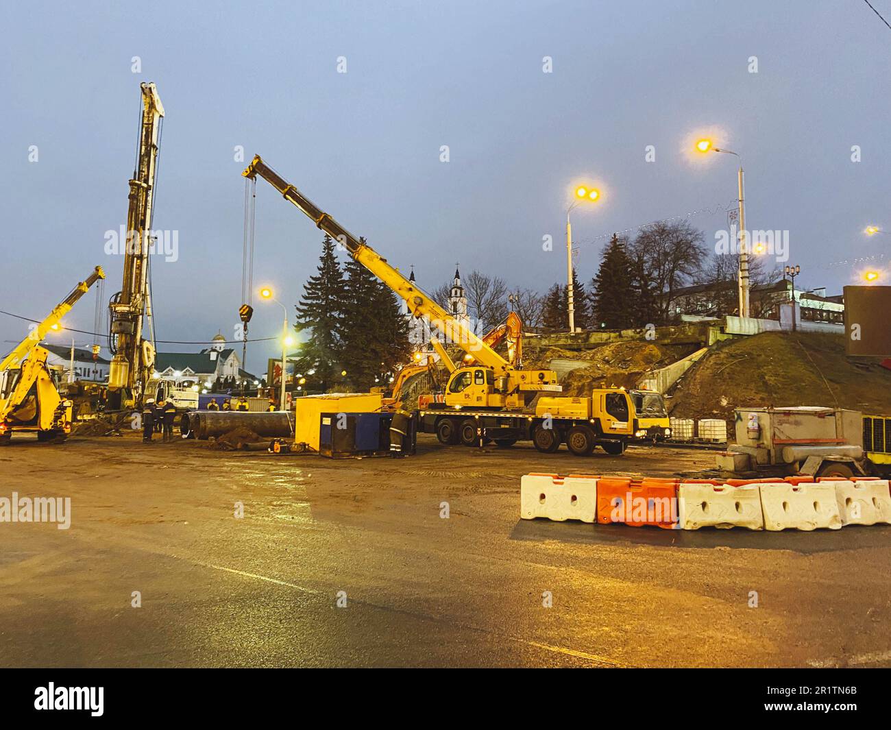construction equipment at the overpass repair site. a tall, yellow ...