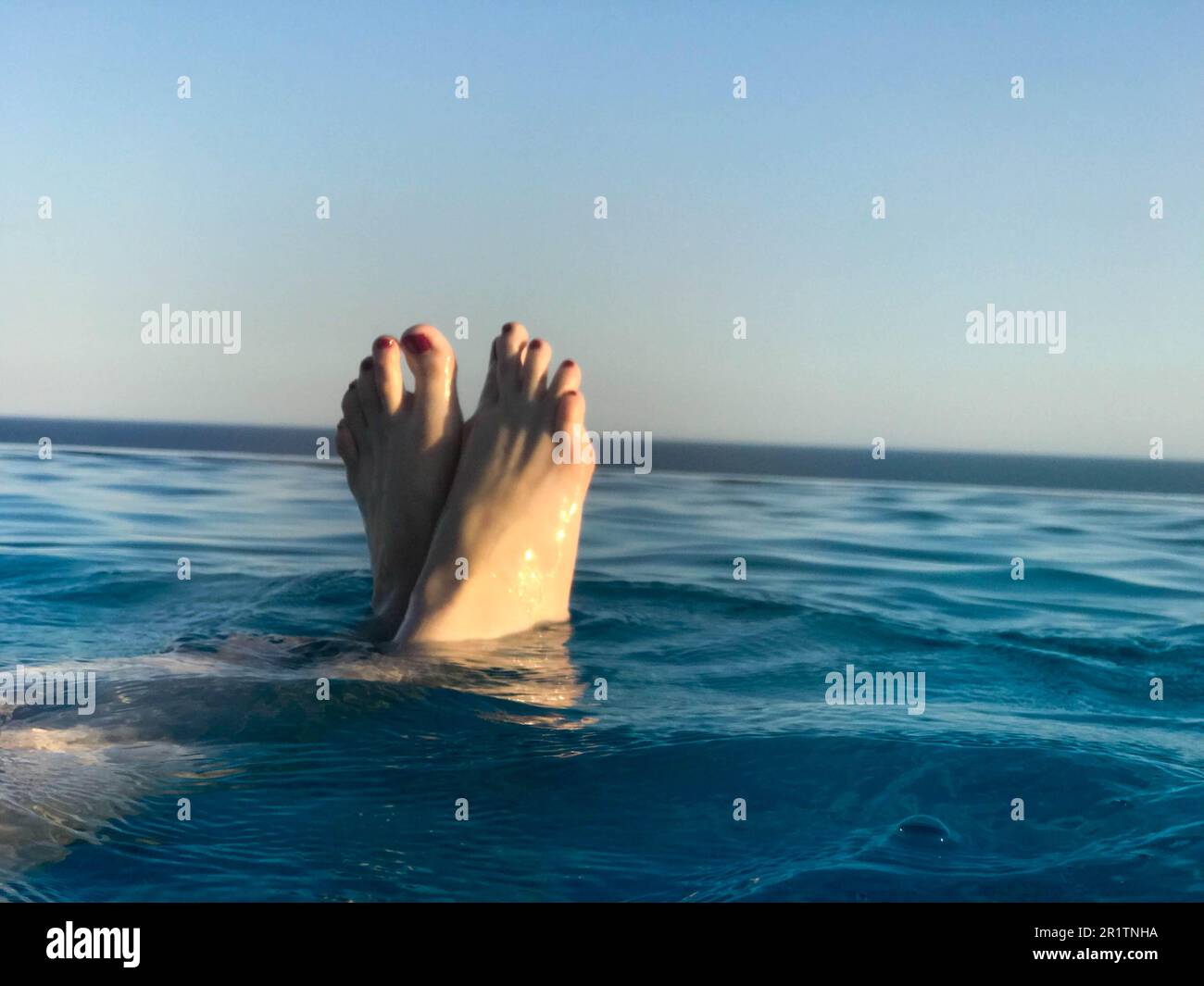 Female feet, feet with fingers spread out with red manicure in ...
