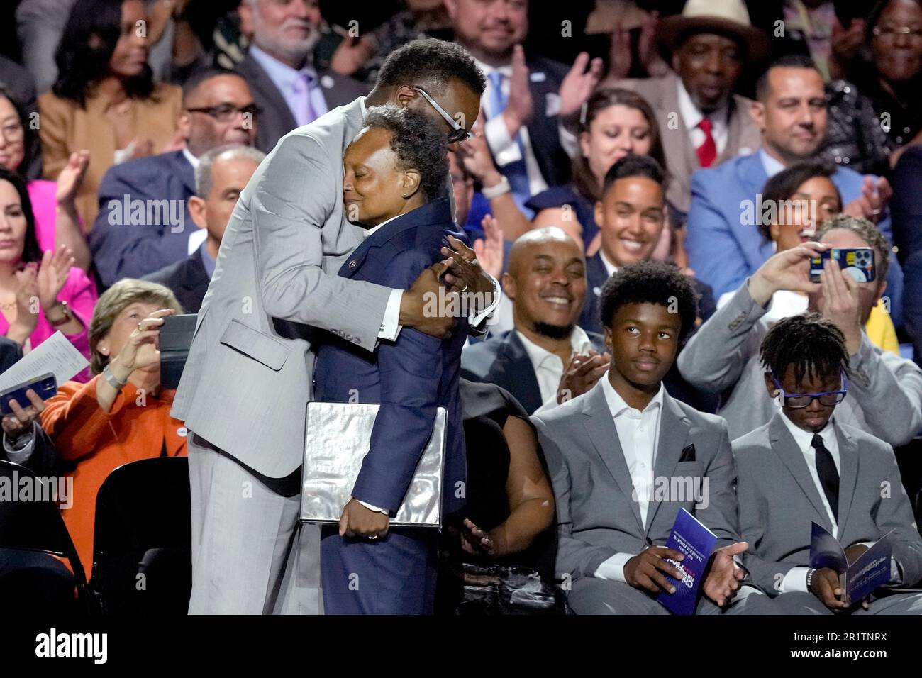 Chicago Mayor-elect Brandon Johnson hugs out-going Mayor Lori Lightfoot ...