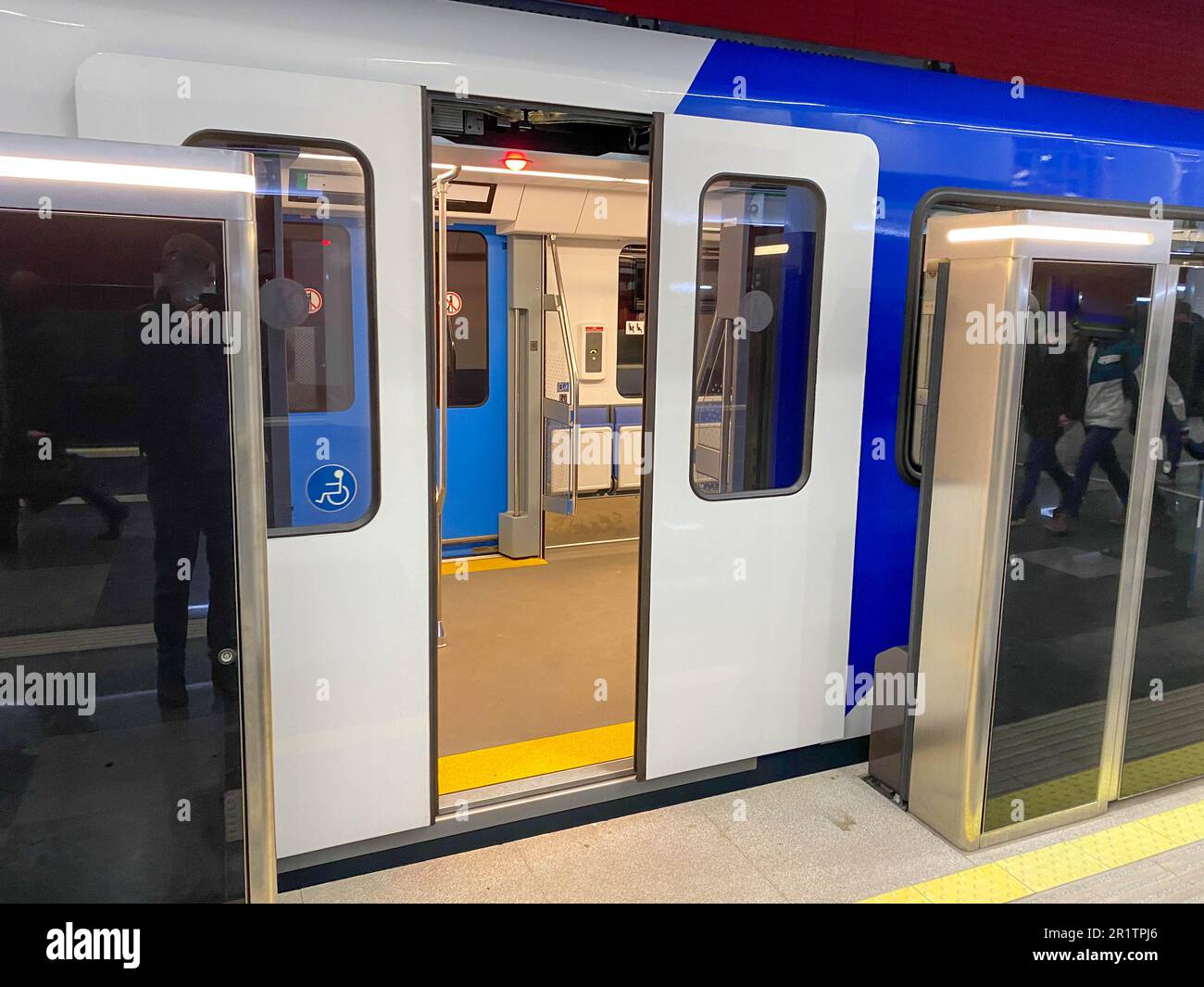 High speed train with opened automatic doors at the platform railway ...