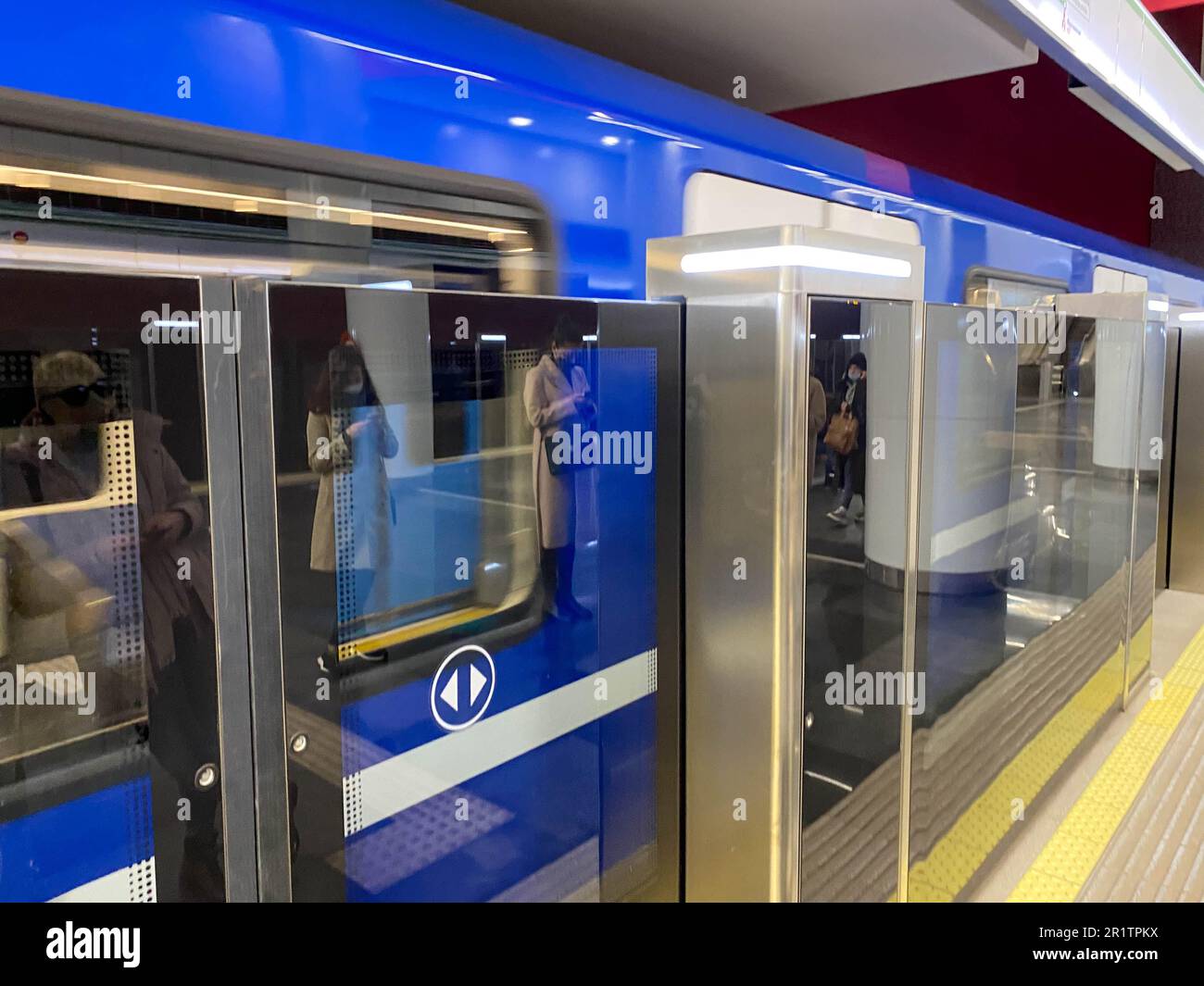 Blue subway wagon with yellow light inside stay at the empty platform ...