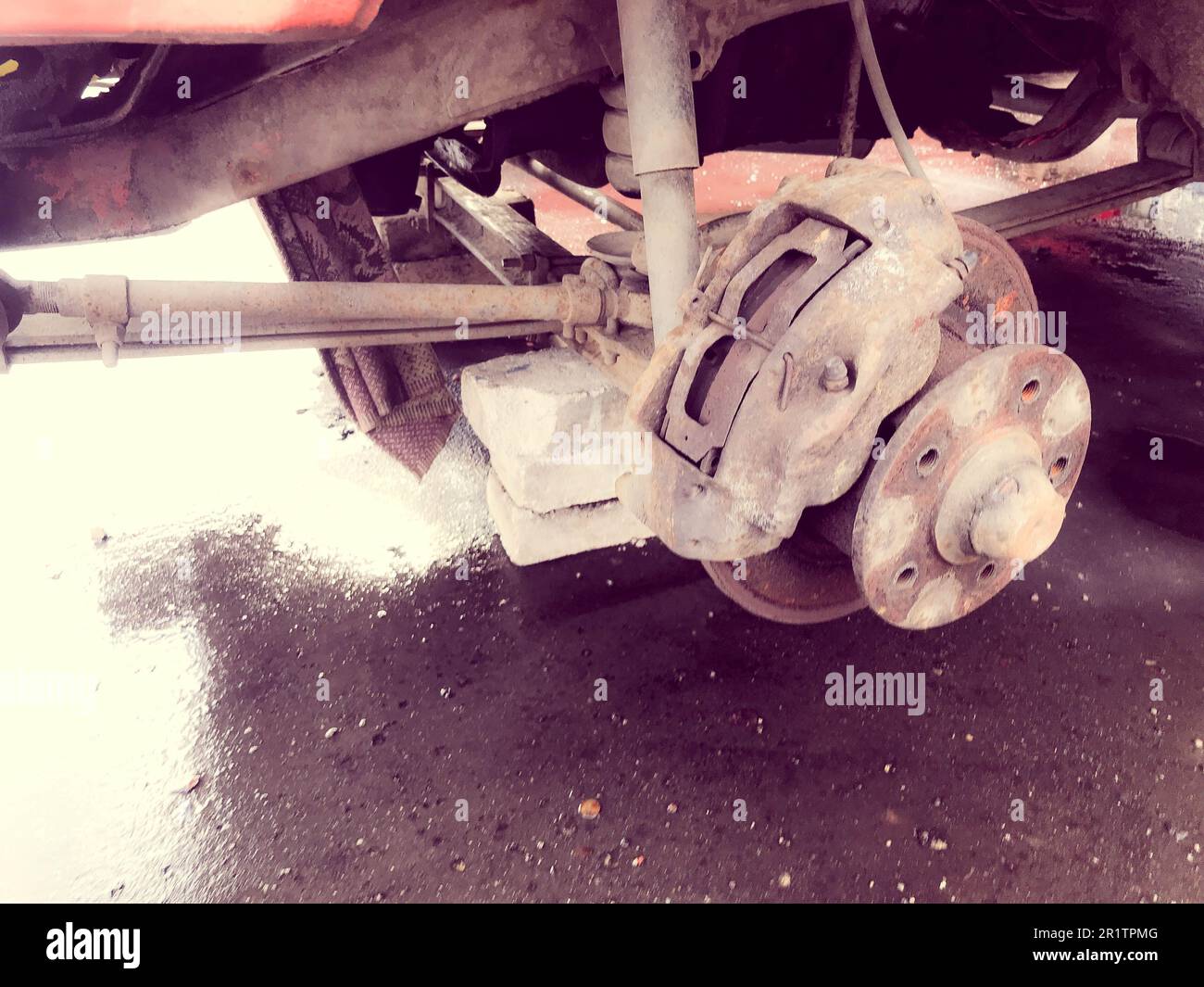 Old rusty worn brake discs, pads of a truck, car. Car suspension repair ...