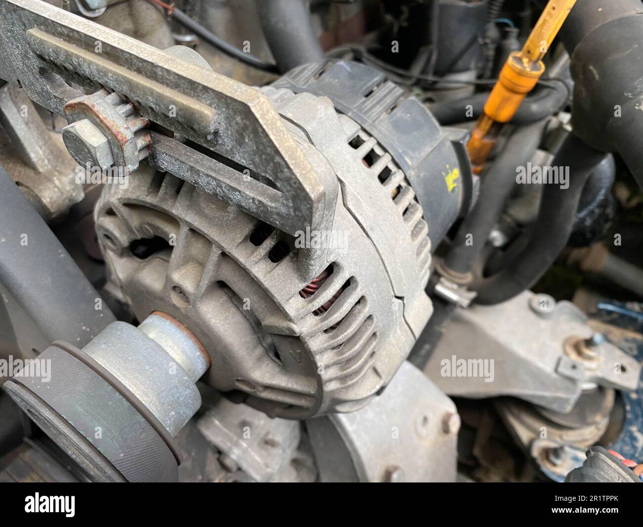 Engine compartment under car hood with emphasis on oil dipstick ...