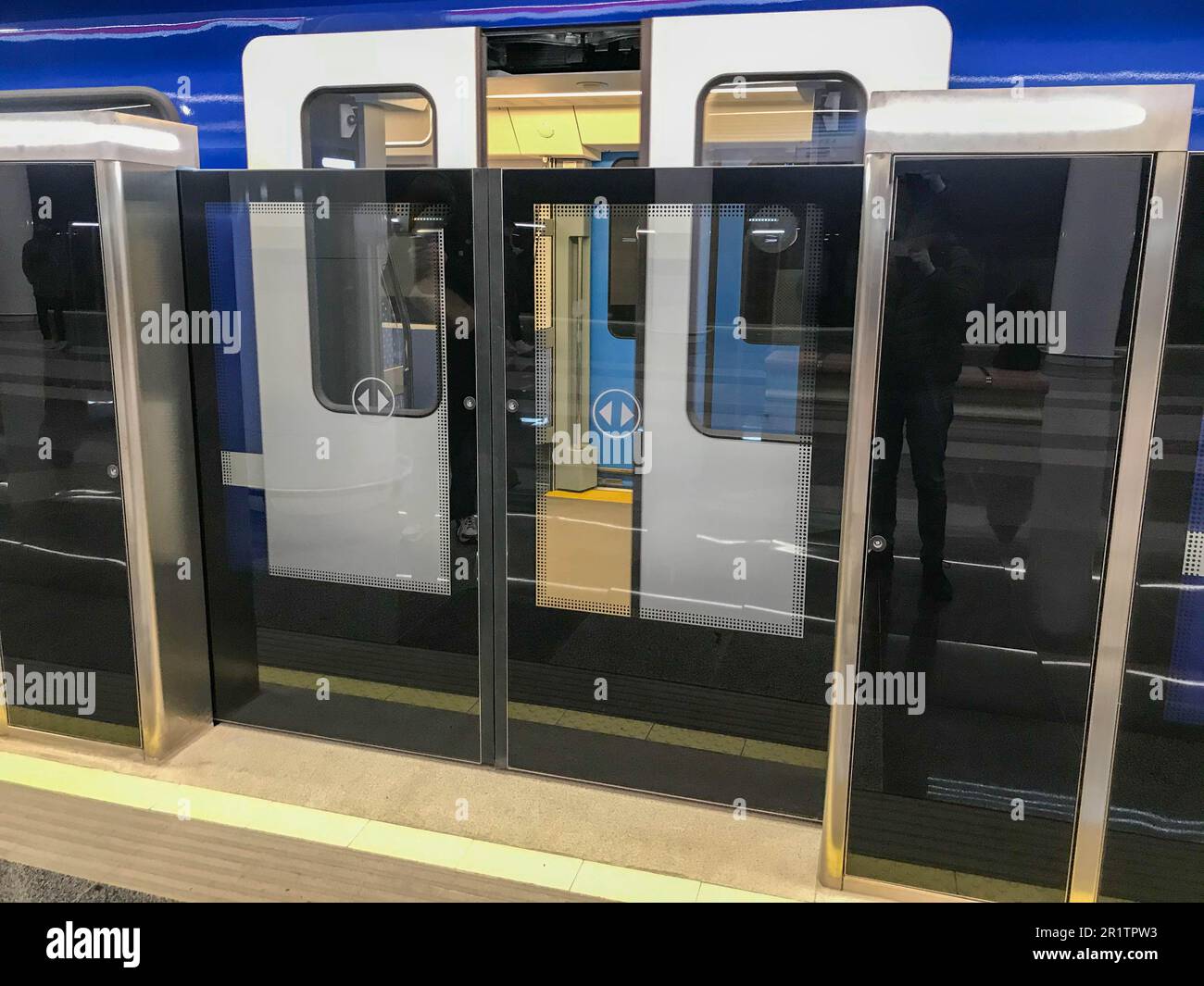 A modern high-speed train in a new beautiful modern underground station ...