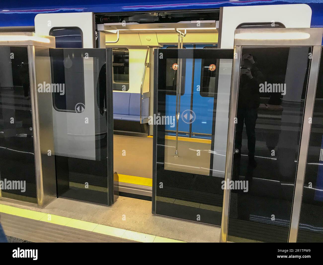 A modern high-speed train in a new beautiful modern underground station ...