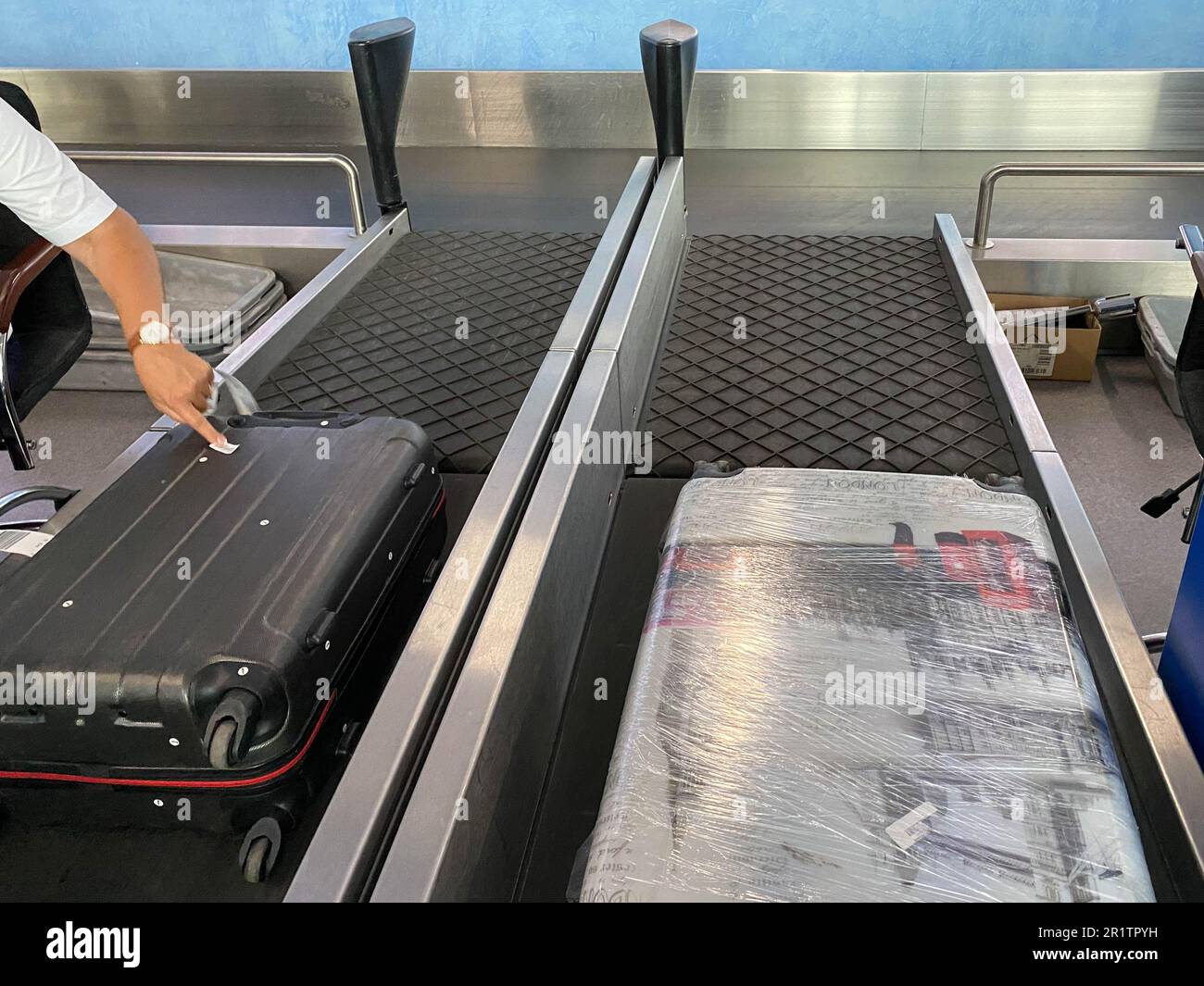 Luggage tape. A suitcase after check-in flight counter, desk rides in ...