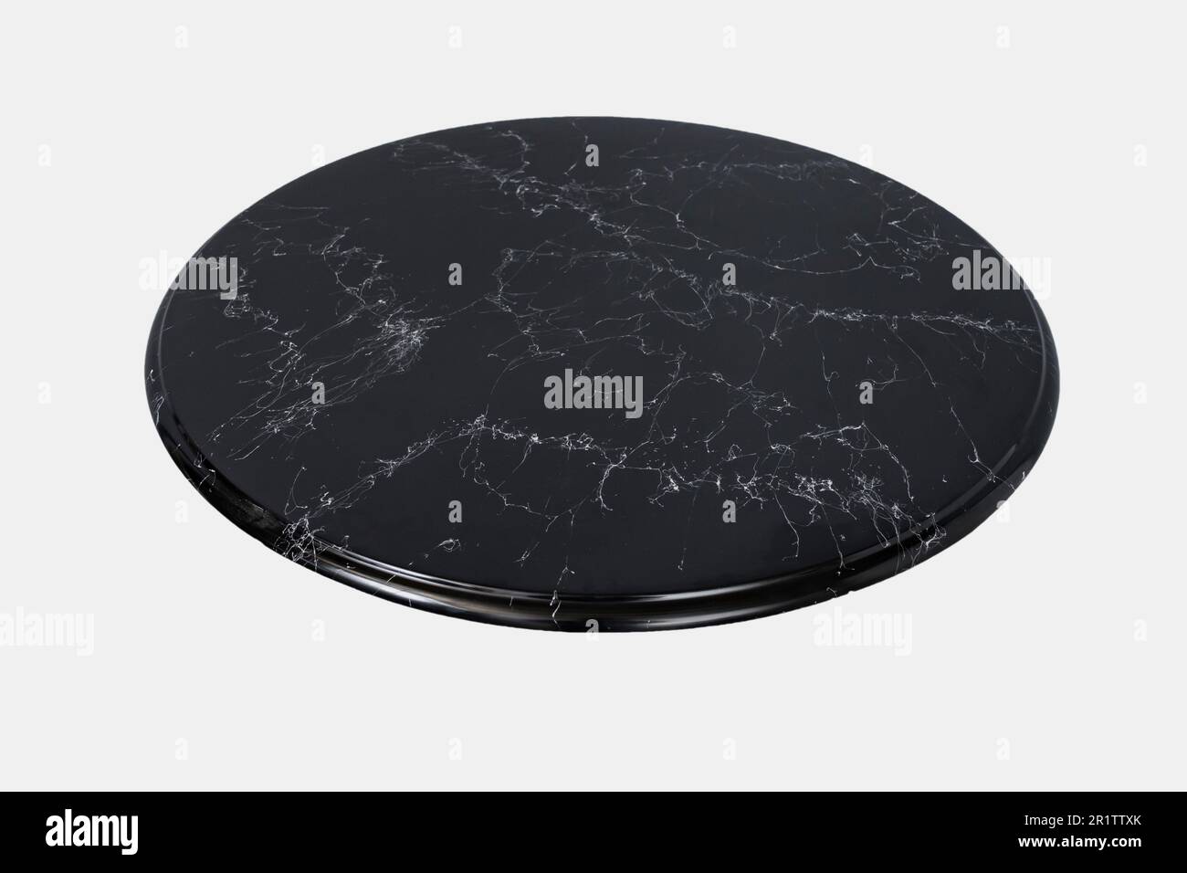 Round black marble table top slab isolated on white background, side ...