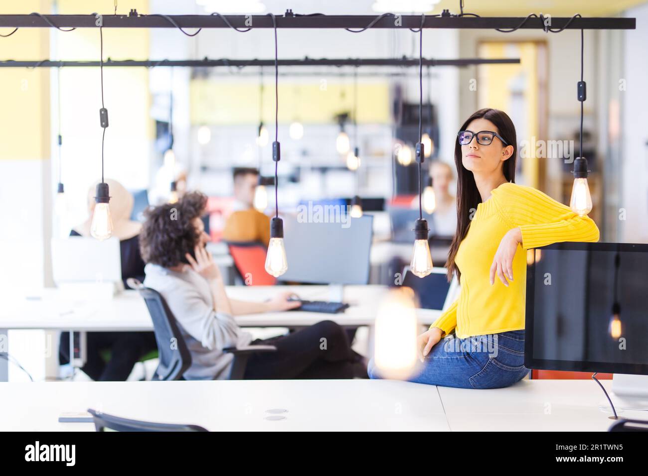 Creative team of young successful people in a modern office. Portrait ...