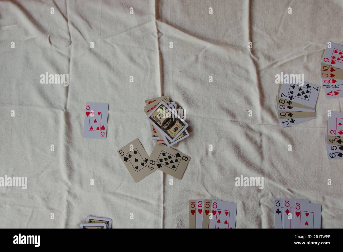 playing cards scattered on the table Stock Photo - Alamy
