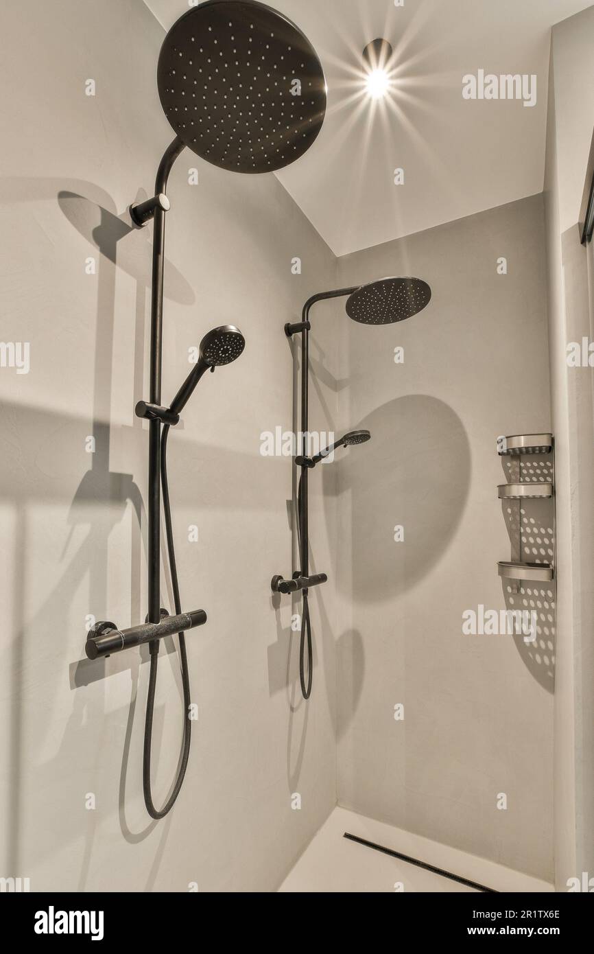 a modern bathroom with shower head and hand held shower fauced on the ...