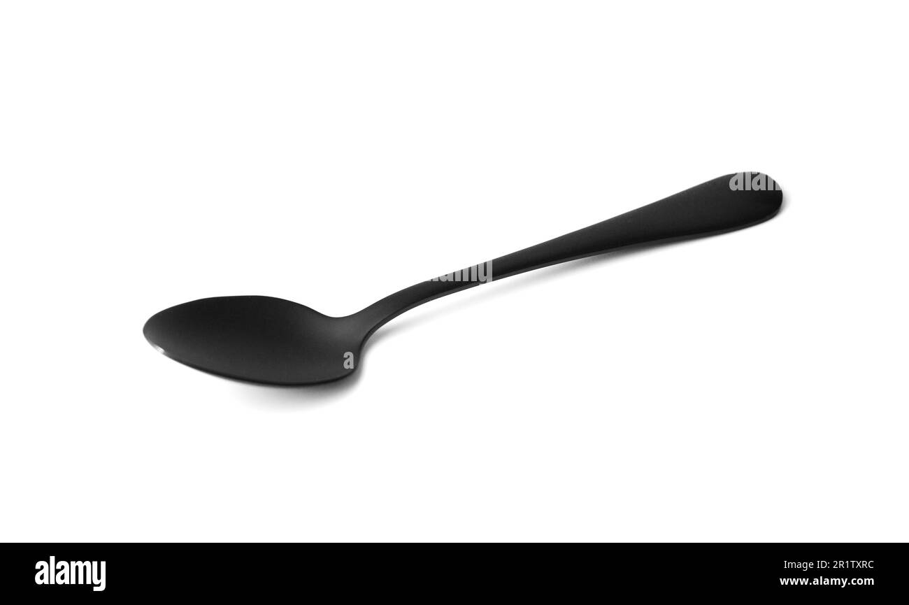 Metallic black matte spoon on white insulation, black cutlery on a ...