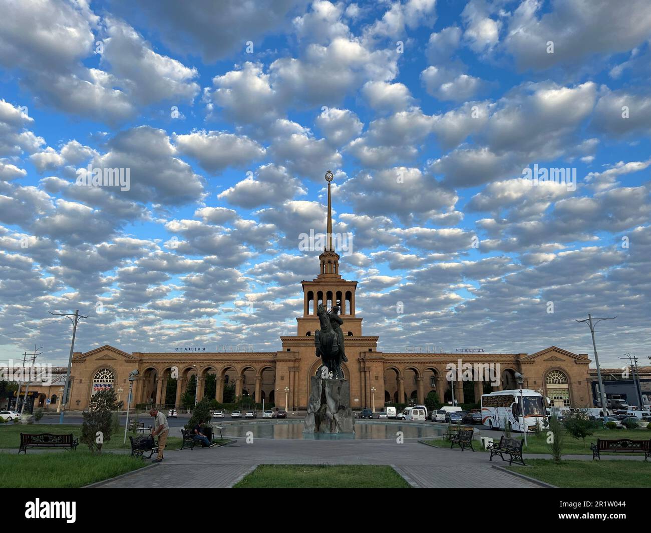 A bronze Sasuntsi David statue in front of a large building subway ...
