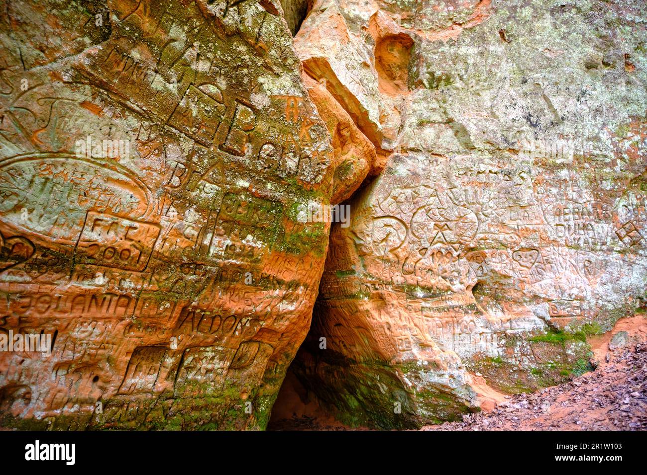 Red sandstone cliffs. Entrance to the cave in Gauja park, Sigulda ...