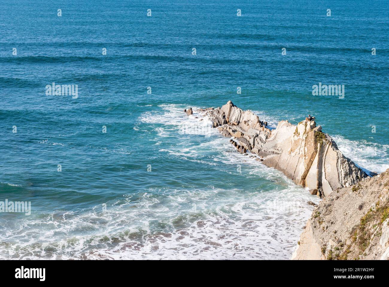 Big Waves crashing creating white foam that vaporises in the air ...