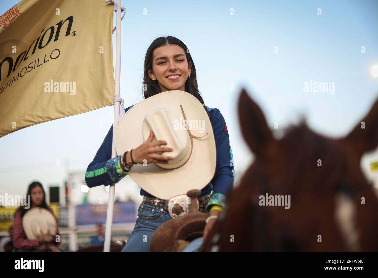 Cowboys, during the rodeo circuit at the Expo Ganadera de Sonora, on ...