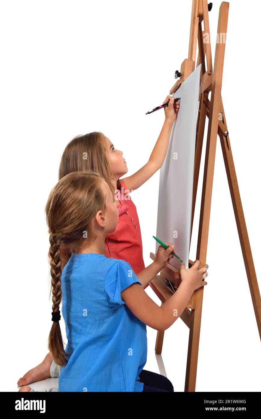 two little girl painting on a blank easel Stock Photo - Alamy