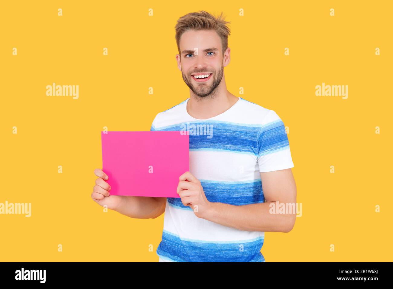 positive man offer his product advertisement. man holds paper with ...