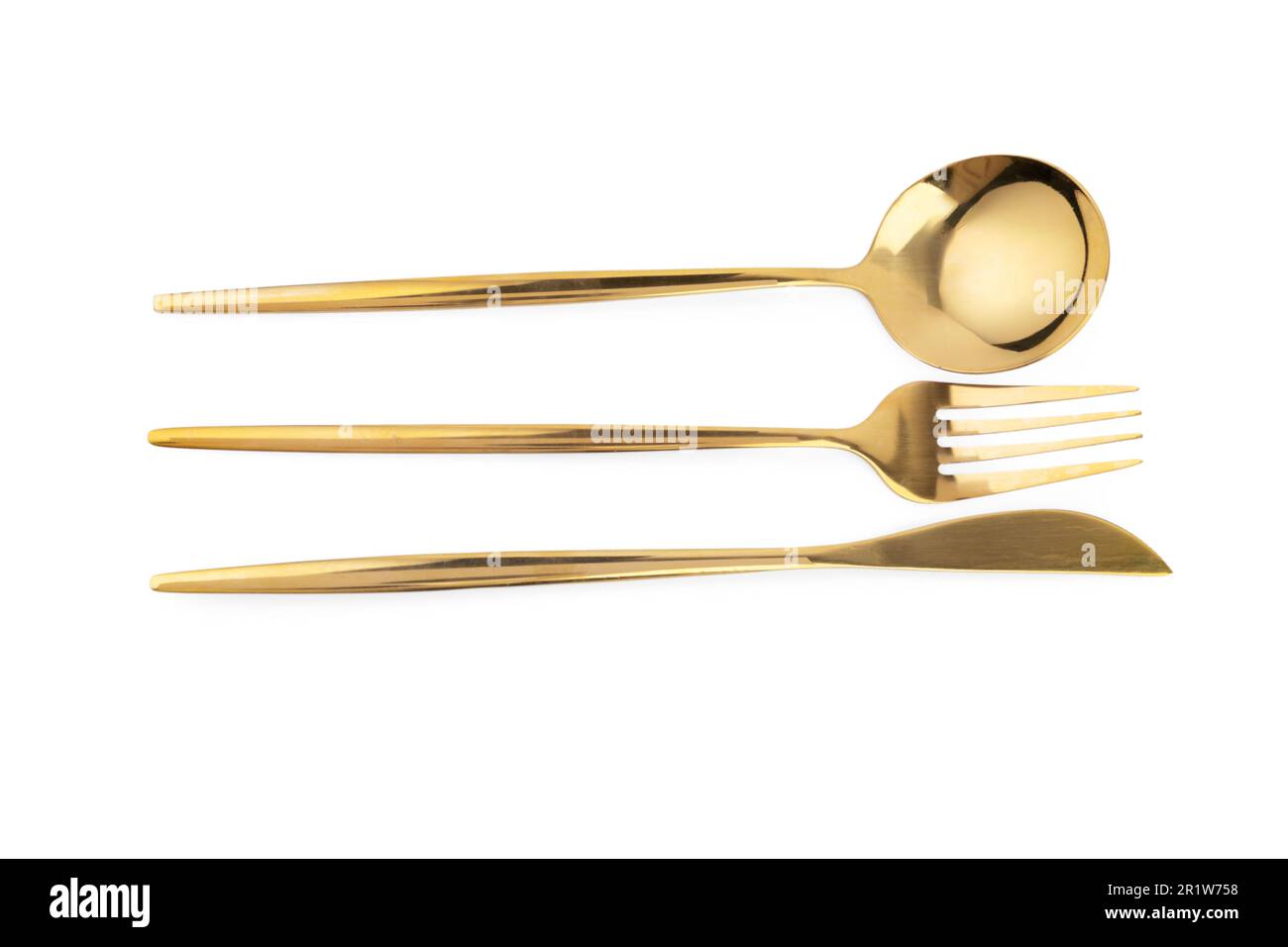 Golden cutlery on top Cut Out Stock Images & Pictures - Alamy