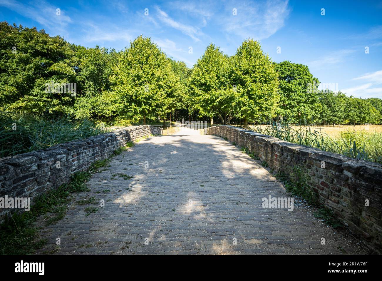 Old roman folly bridge in english landscape garden in park of castle ...