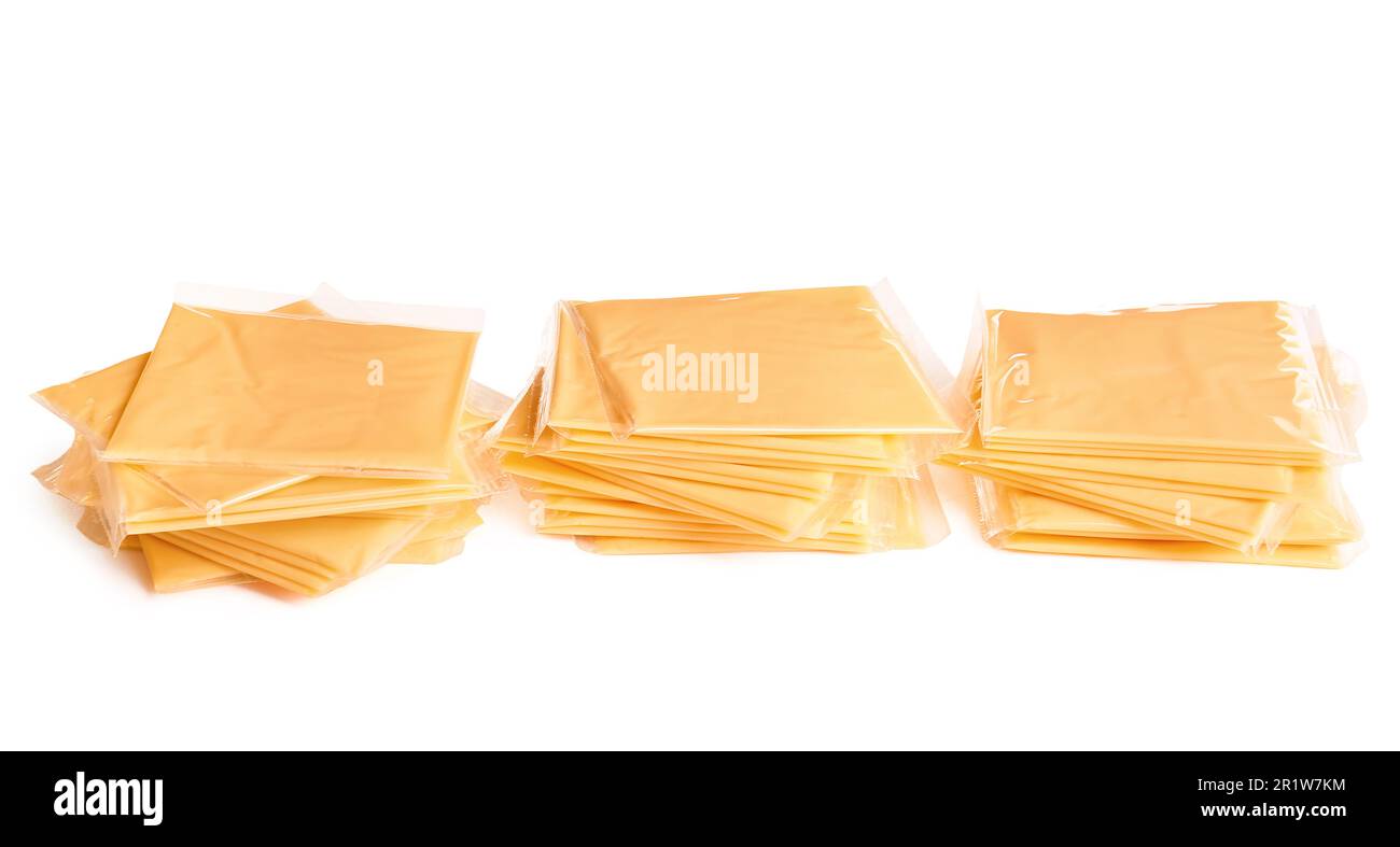 Slices of tasty processed cheese on white background Stock Photo - Alamy