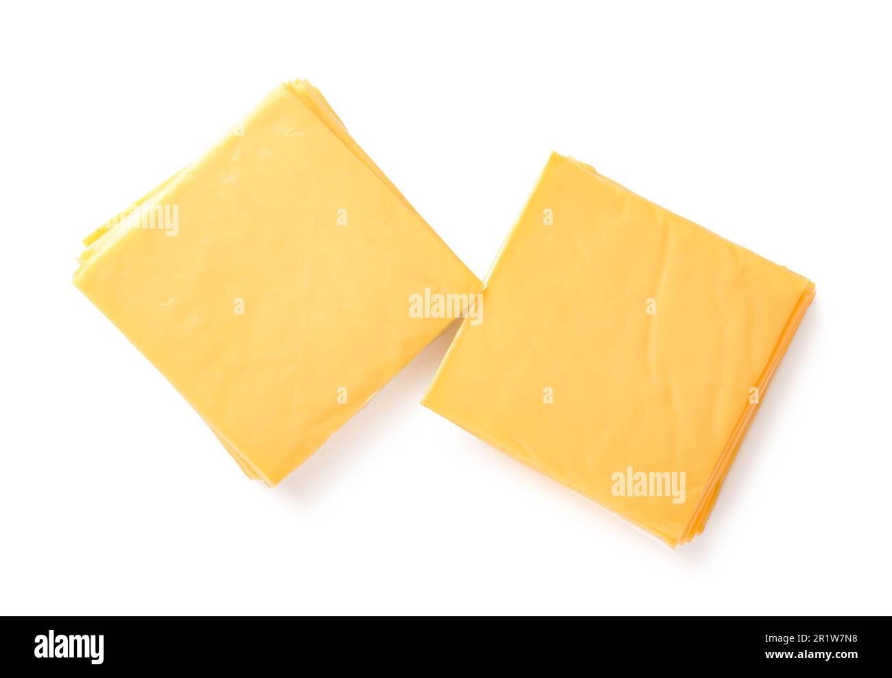 Pieces of cheddar cheese top view Cut Out Stock Images & Pictures - Alamy
