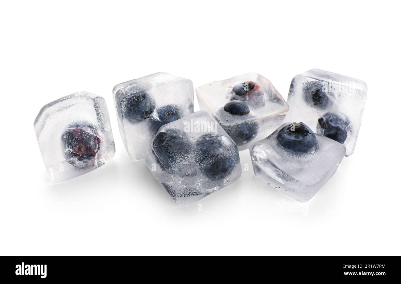 Fresh blueberry frozen in ice cubes on white background Stock Photo - Alamy