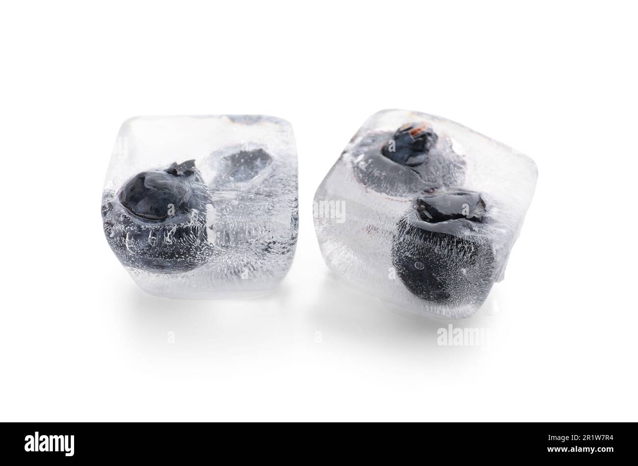 Fresh blueberry frozen in ice cubes on white background Stock Photo - Alamy
