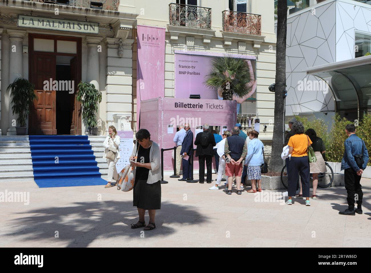 May 15, 2023, Cannes, CÃ´te d'Azur, France: Festival goers queue at the ticket counter to grab a ...