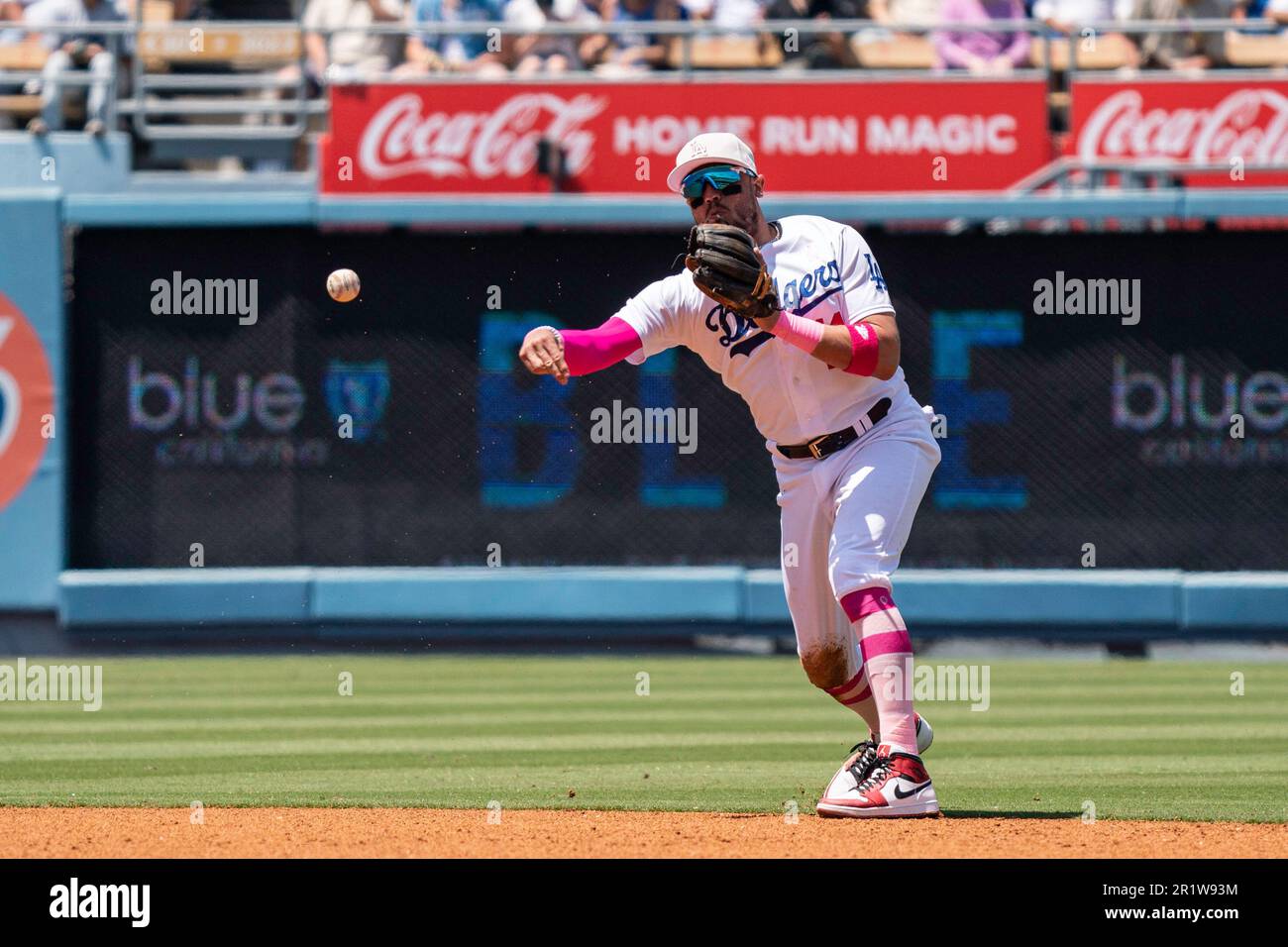 Los Angeles Dodgers shortstop Miguel Rojas (11) throws to first base ...