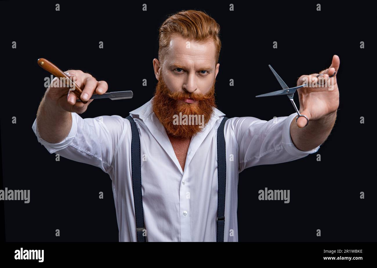brutal barbershop man in studio. barbershop man with scissors and retro ...