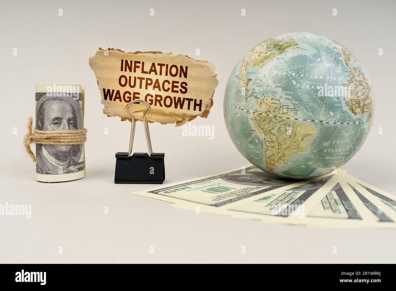 Business and finance concept. On the table are dollars, a globe and ...