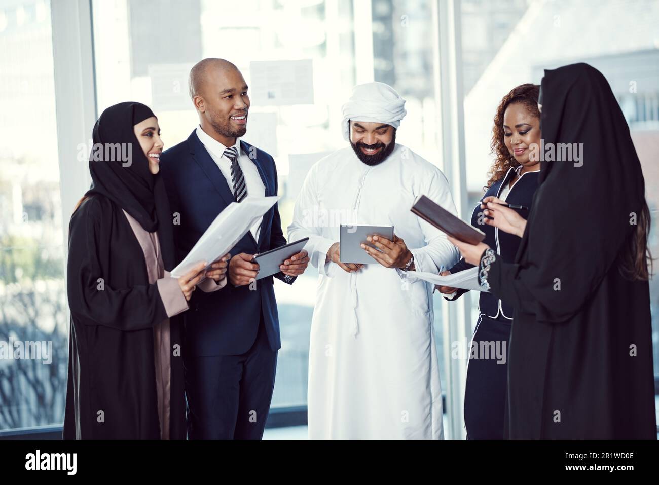 Divide the tasks and multiply the success. a group of diverse business ...