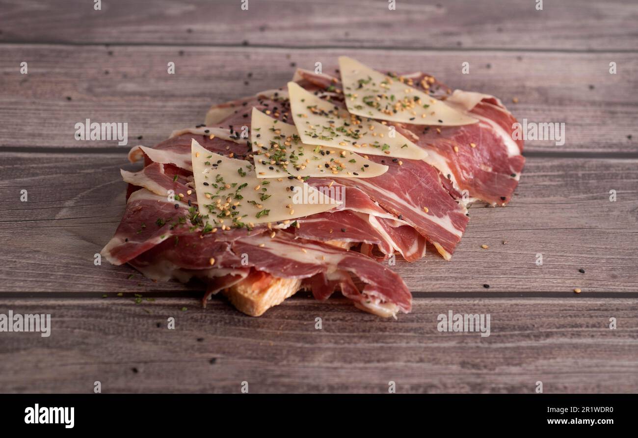 tomato toast, serrano ham and cheese Stock Photo - Alamy
