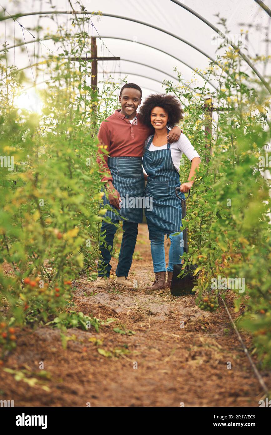 Were growing together. Full length portrait of a young farm couple ...