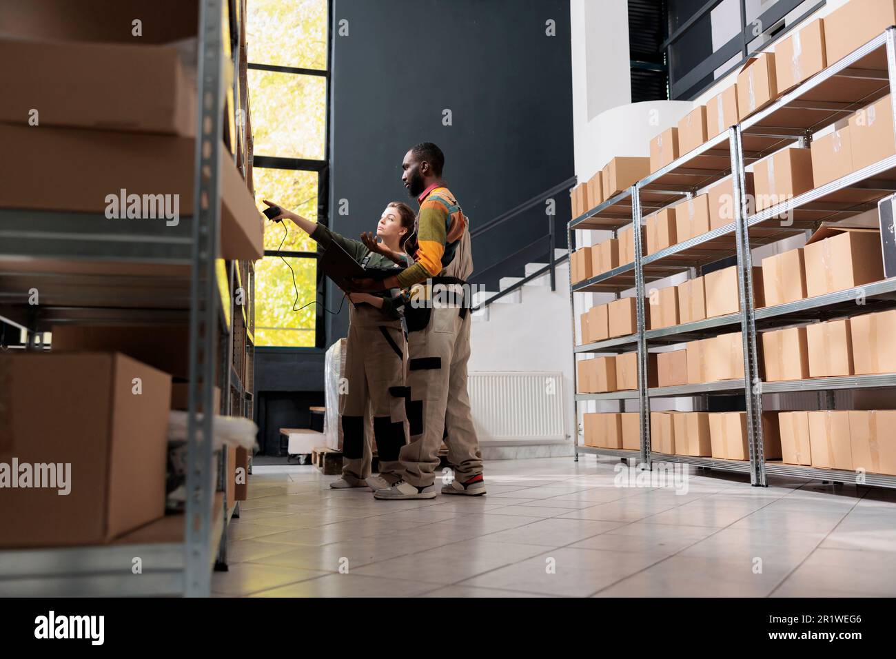 Stock room employee scanning hi-res stock photography and images - Alamy