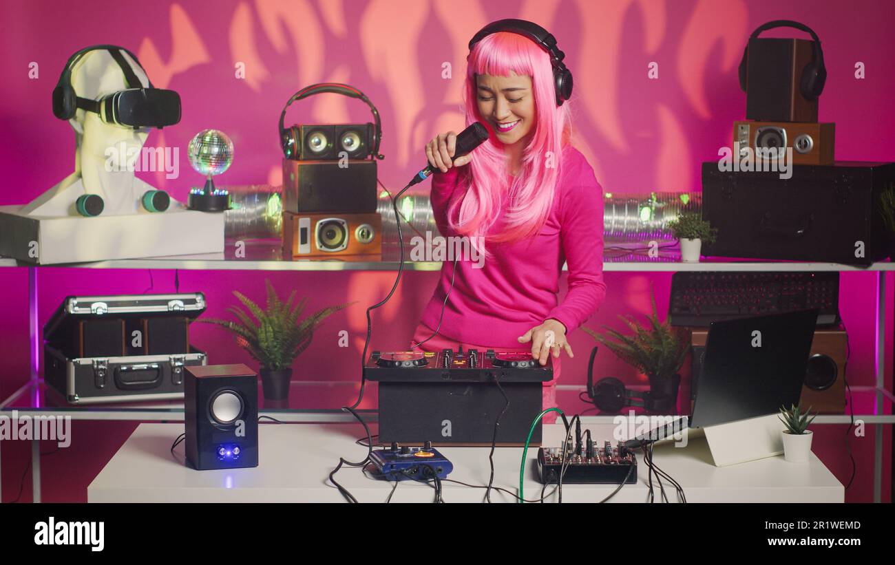 Musician talking with fans into microphone during party Stock Photo - Alamy