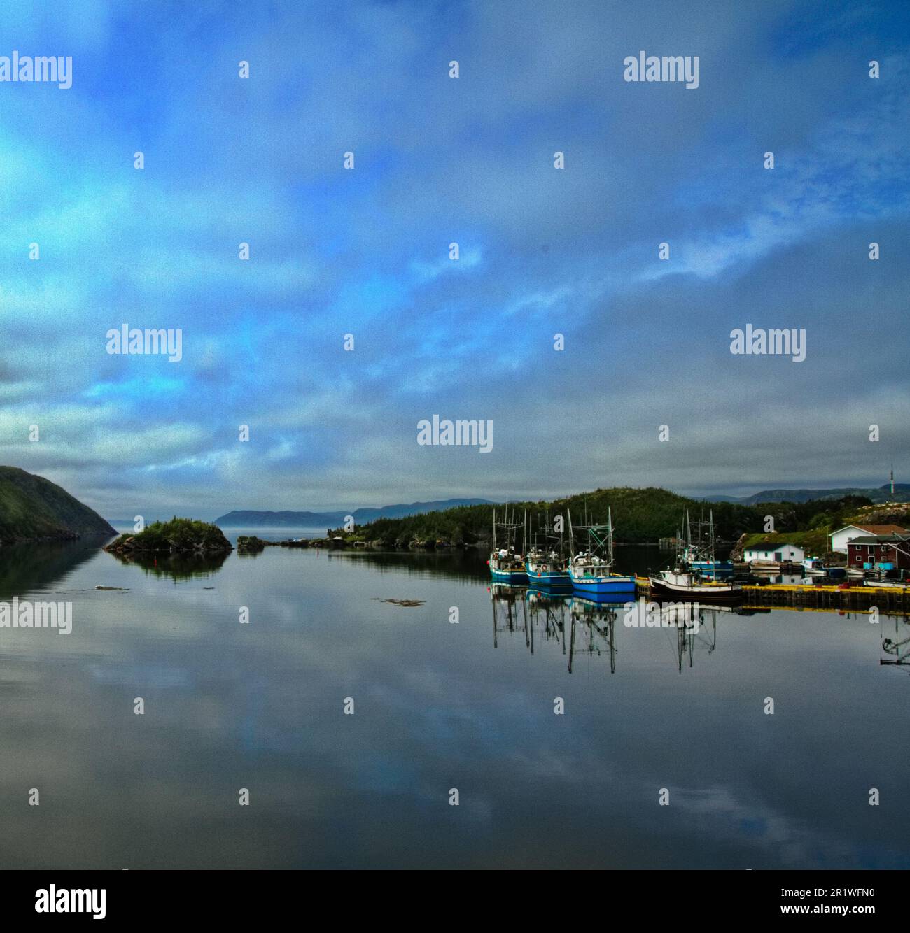 Sky, land, and water seascape of Southport, Trinity Bay, in ...