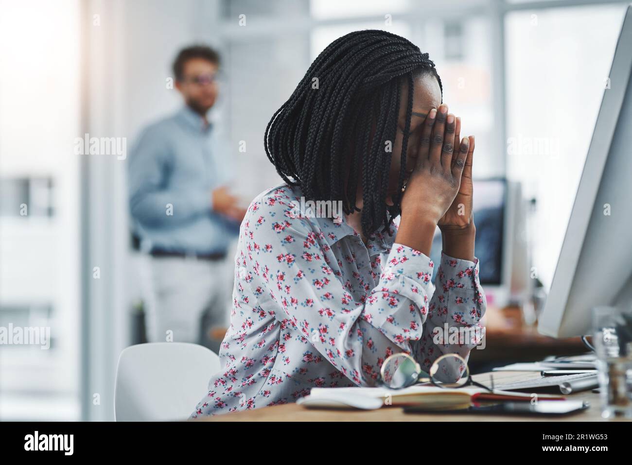 Please, not today. a young woman suffering from stress while using a ...