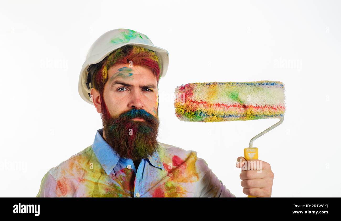 Painter man. Professional painter man in helmet with paint roller ...