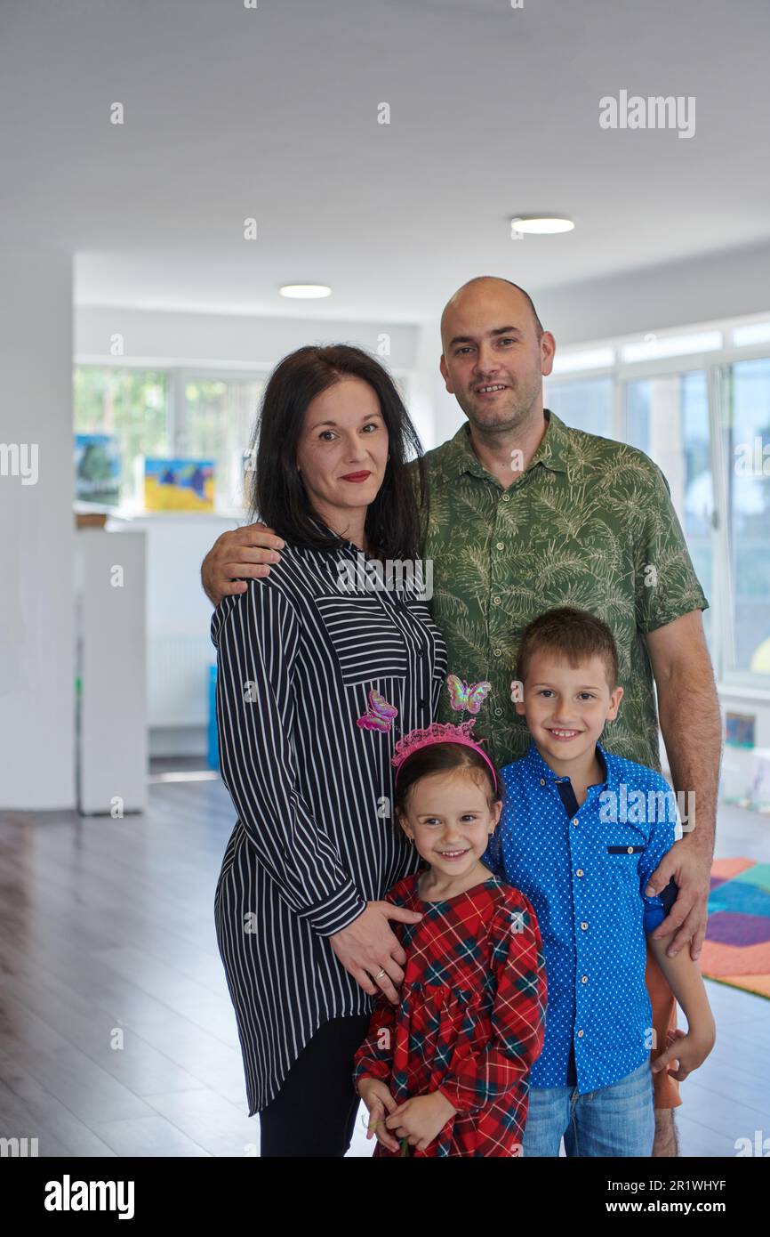 Portrait of a happy family. Photo of parents with children in a modern ...