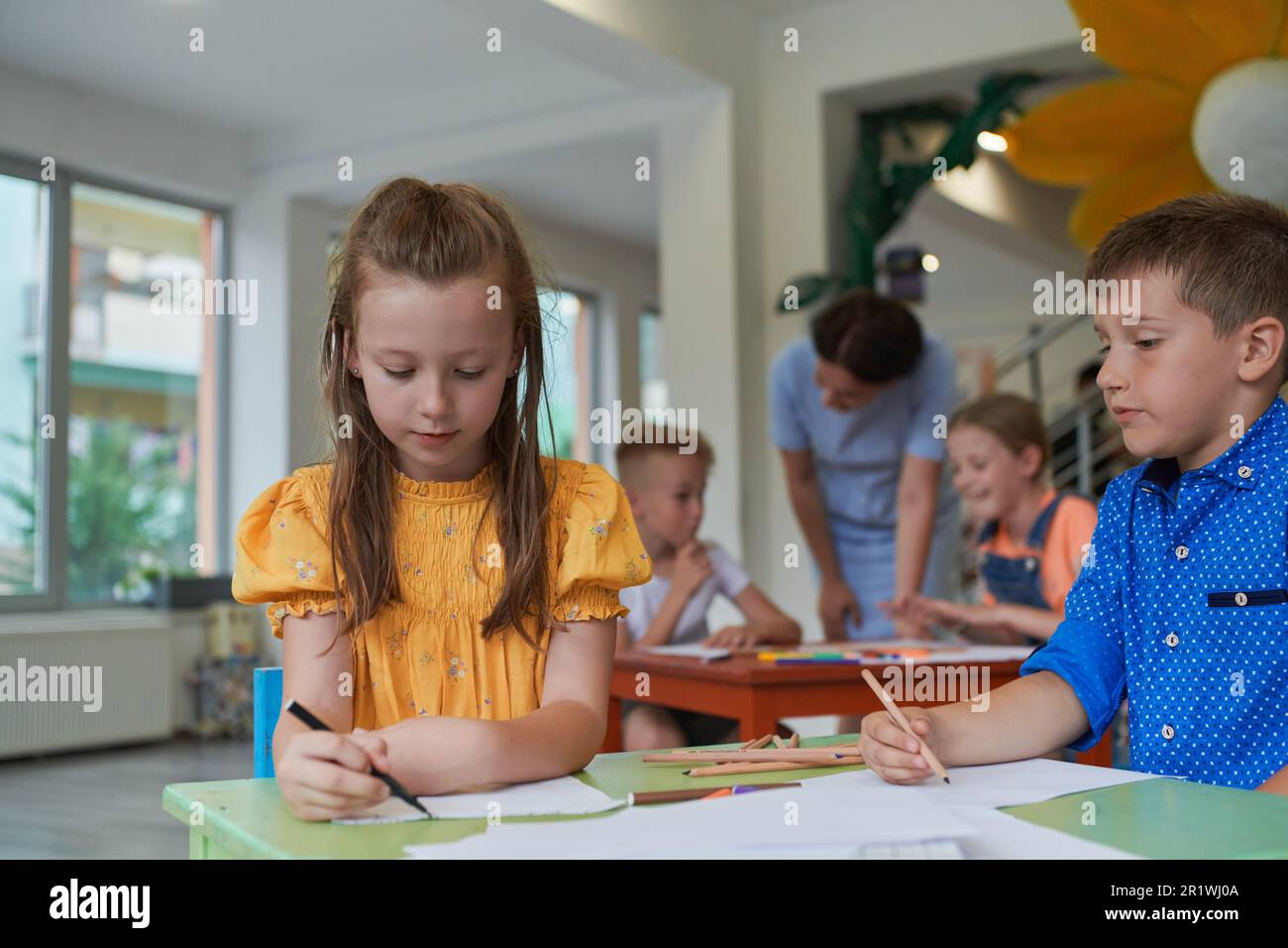 Creative kids during an art class in a daycare center or elementary ...
