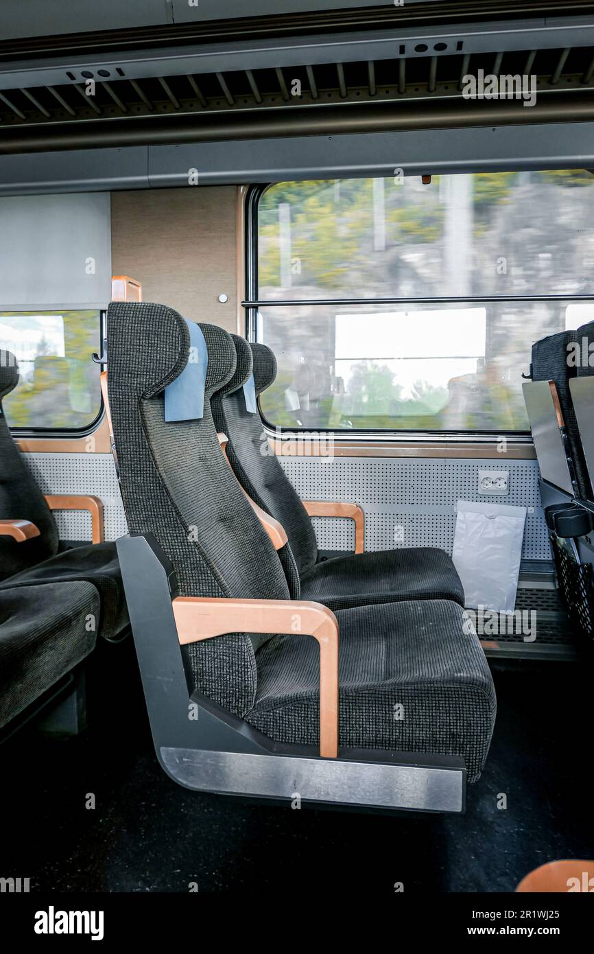 some seats inside a train car with windows Stock Photo - Alamy